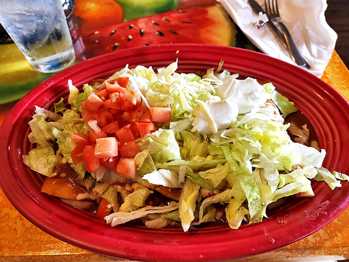 A fiesta of freshness on a red plate. When lettuce and tomatoes look this vibrant, you know you're not at one of those "microwave special" Mexican chains.