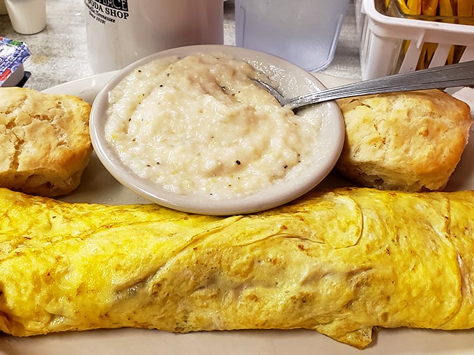 Breakfast doesn't get more honest than this &ndash; a fluffy omelet that practically floats, grits creamier than a love song, and biscuits that could end family feuds.