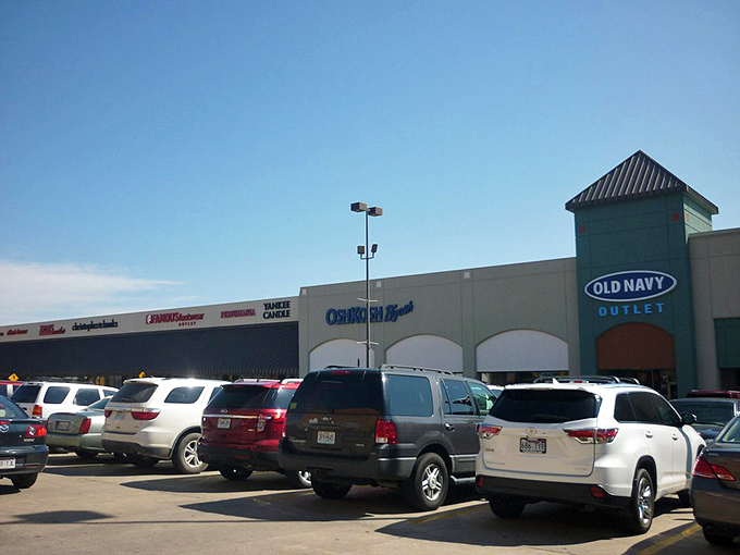 Old Navy beckons with its siren song of affordable basics. The parking lot's fullness serves as a testament to the treasures waiting inside.