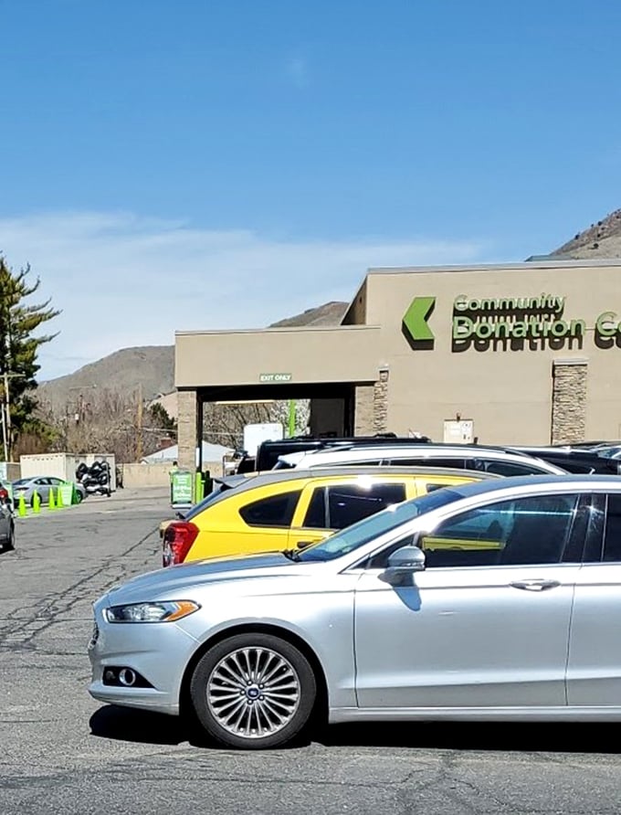The donation center entrance with mountain backdrop. Your castoffs become someone else's treasures while supporting community nonprofits.