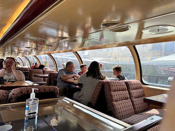 Inside the observation car, strangers become fellow travelers as panoramic windows frame a shared adventure through Minnesota's northern wilderness.
