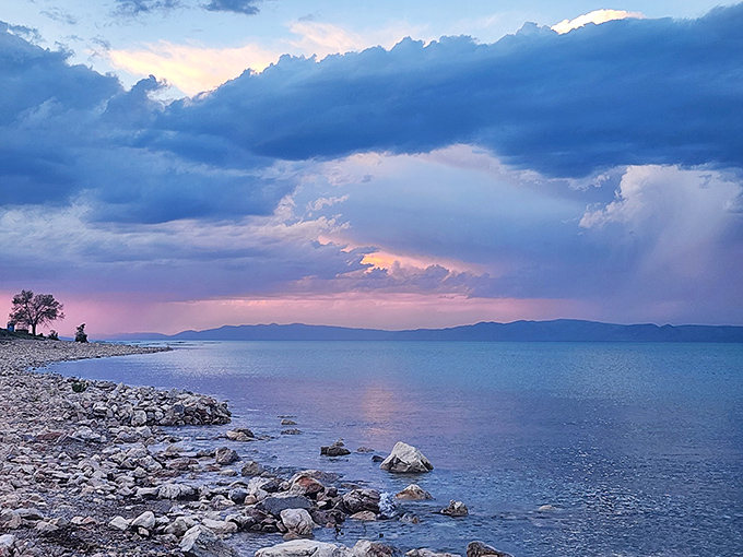 Sunset chemistry experiment: mix mountains, water, and fading light for a display that makes smartphones weep with inadequacy.