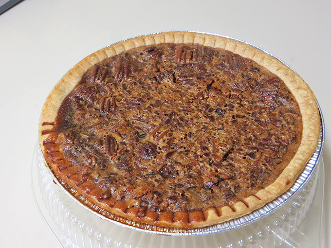 This pecan pie isn't just dessert—it's an edible piece of Americana that would make your grandmother simultaneously proud and jealous of their crust technique.