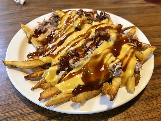 Barbecue fries &ndash; where pulled pork meets golden potatoes under a Jackson Pollock splatter of sauce and cheese. Utensils strongly discouraged.