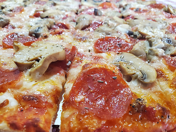 Even the pizza at a barbecue joint deserves respect&mdash;loaded with toppings and that perfect cheese pull that makes you temporarily forget you came for the smoked meats.