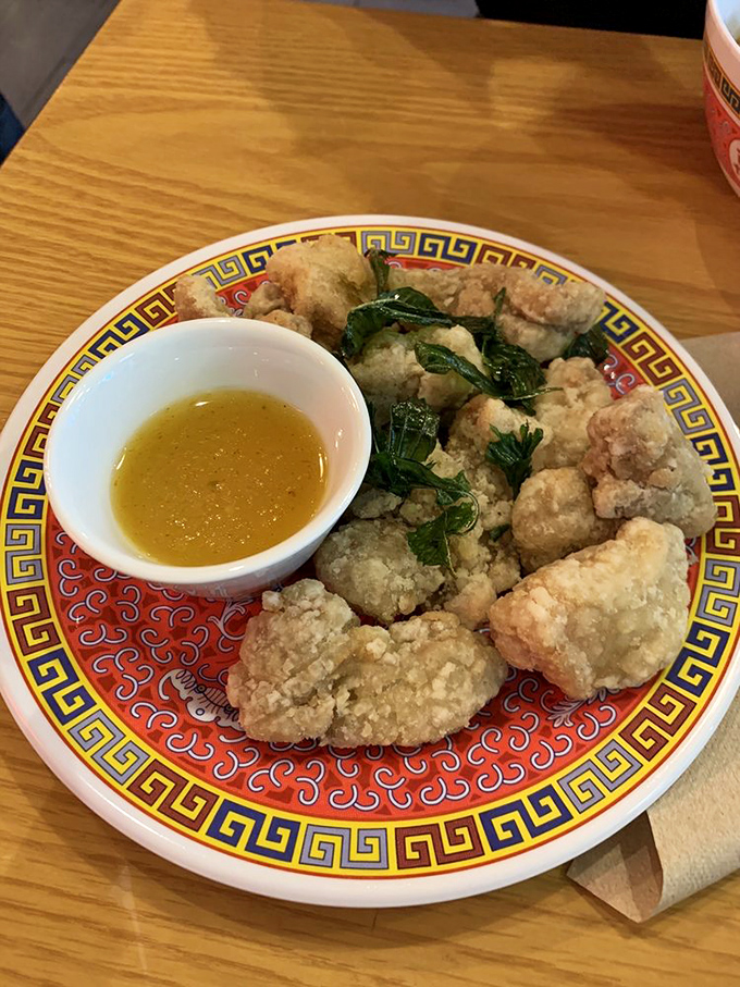 Golden, crispy popcorn chicken with basil that's actually crispy, not soggy&mdash;a rare and beautiful thing in this world.