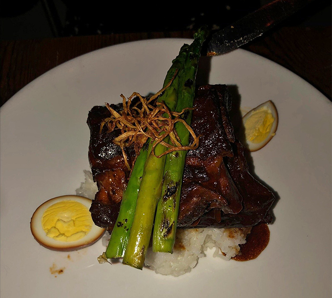 The legendary pork ribs&mdash;caramelized, tender, and served with perfectly charred asparagus&mdash;are why people dream about this place at random Tuesday meetings.