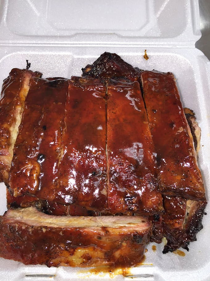 These ribs don't just fall off the bone&mdash;they practically leap onto your fork, glistening with a sauce that balances sweet, tangy, and smoky notes.