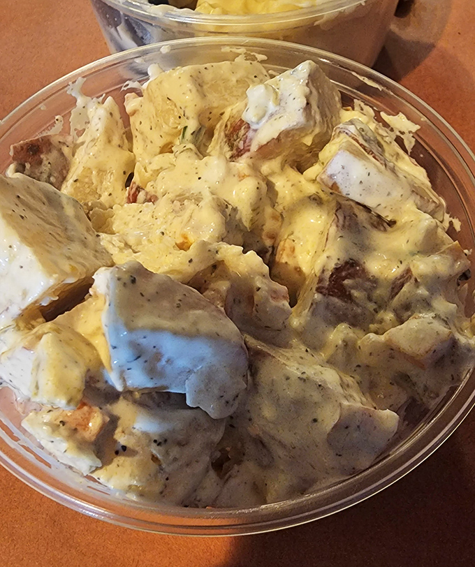 Potato salad that doesn't know it's a side dish, strutting around with enough flavor confidence to steal the spotlight from the main attraction.