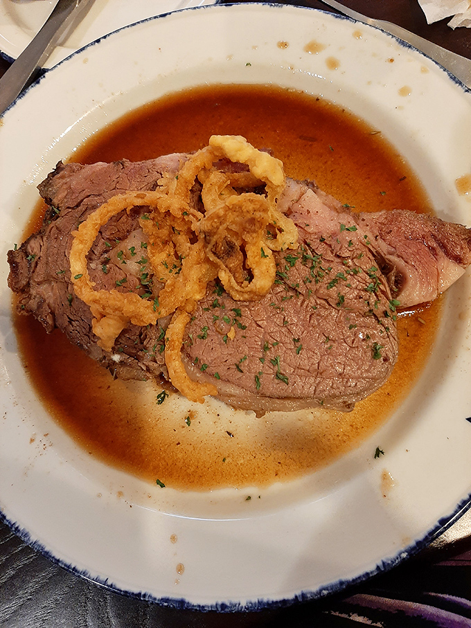 Prime rib so perfectly cooked it deserves its own Instagram account, topped with crispy onion rings that add both flavor and architectural interest. 