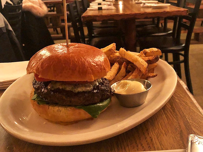 The burger arrives like a celebrity making an entrance&mdash;glistening, photogenic, and surrounded by a posse of hand-cut fries that aren't just an afterthought.