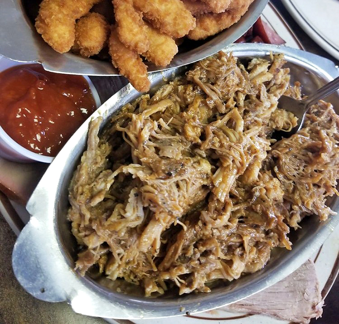 Pulled pork that looks like it's been coaxed apart by angels, ready to melt in your mouth alongside those crispy nuggets.