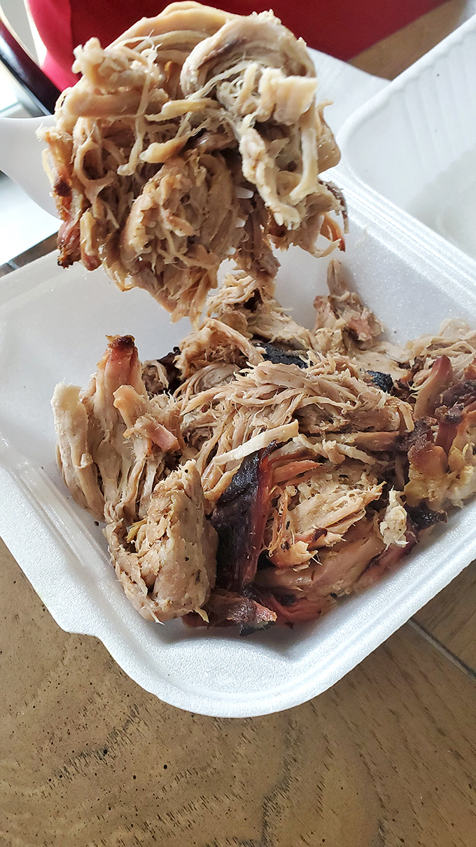 Pulled pork that actually looks pulled, not chopped or mangled. Those strands of smoky goodness are ready for their close-up&mdash;and your mouth.