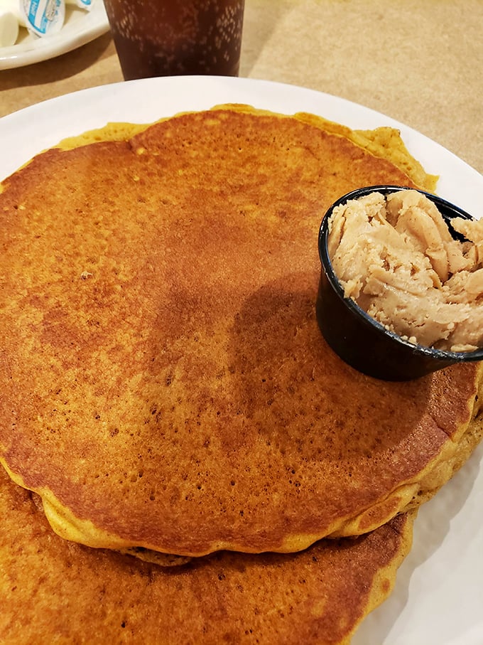Pancakes so golden-brown they could win medals, served with a side of butter that's melting faster than my willpower in a bakery.