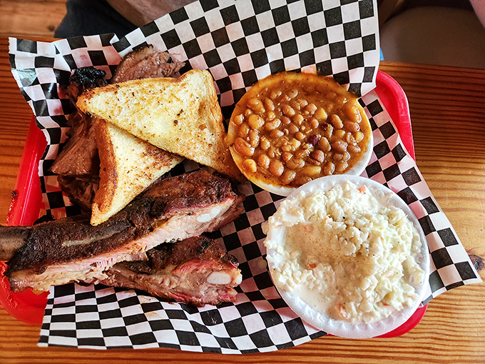 Ribs, toast, beans, and slaw&mdash;the four food groups of happiness arranged on a tray of pure barbecue bliss.