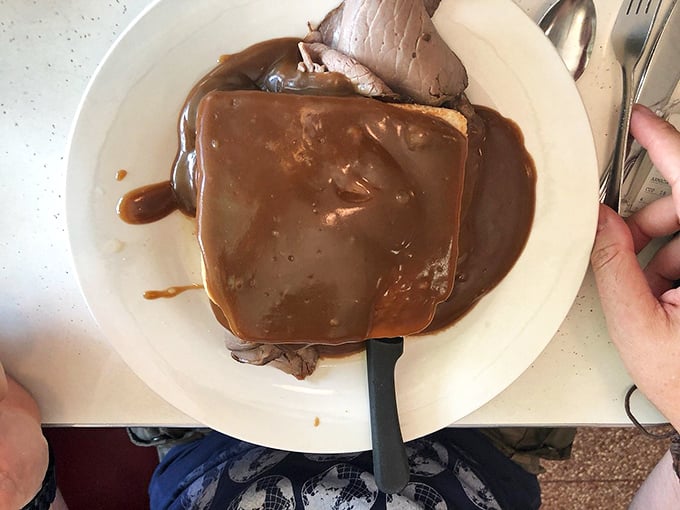 Hot roast beef sandwich: where bread becomes a gravy delivery system. This open-faced classic has been solving Pennsylvania's problems since forever.