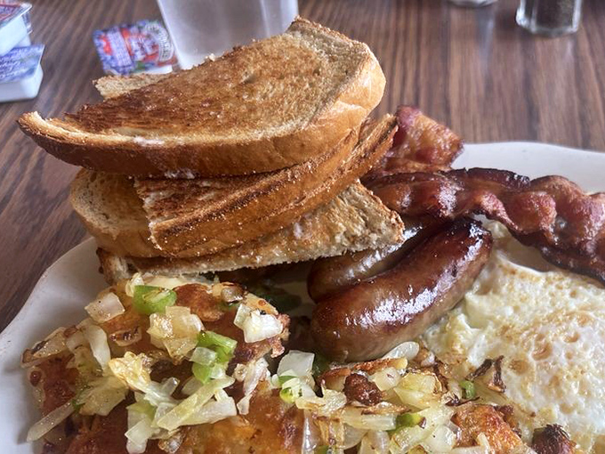The breakfast trinity: perfectly toasted bread, crispy hash browns, and sausage links glistening with promise. Good morning, indeed!