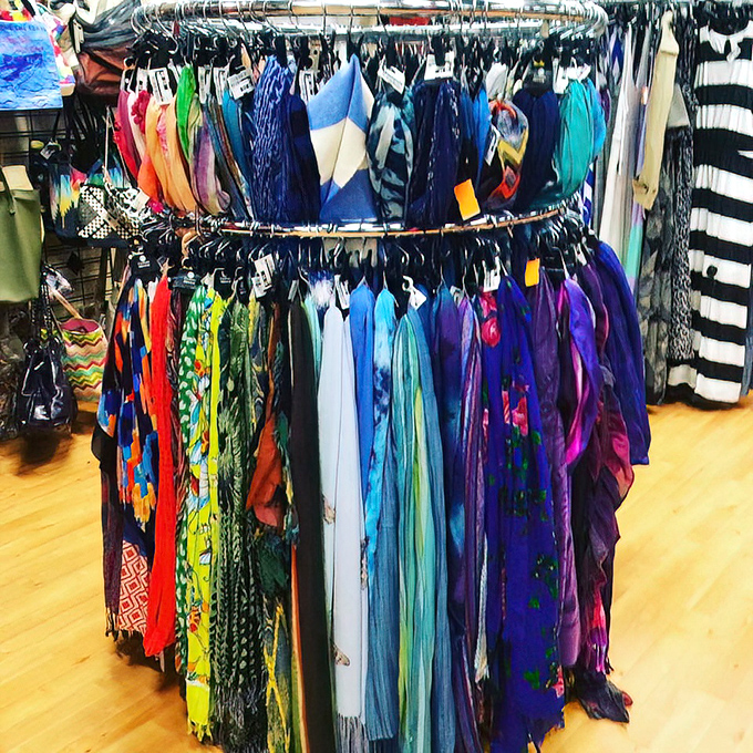 A rainbow of scarves awaits their moment to transform ordinary outfits into "Where did you get that?" conversation starters.