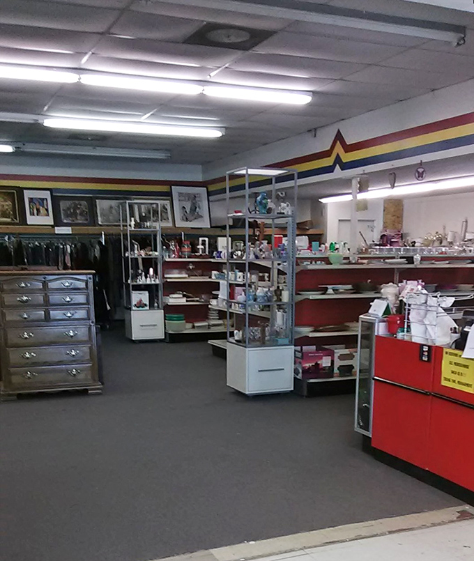 The rainbow stripe running along the wall is like a promise—follow it to the pot of secondhand gold at prices that won't break the bank.