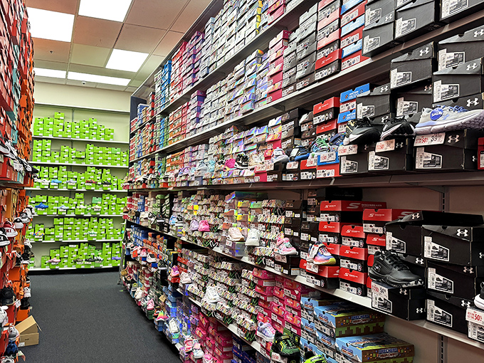 The sneaker wall at the outlet's athletic store resembles the world's most organized candy shop for feet. Somewhere in this footwear fantasy is your sole mate.