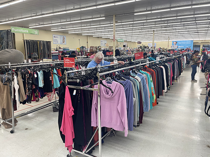 Shoppers browse through racks organized by color and size. The thrill of the hunt keeps everyone focused on finding their next favorite piece.