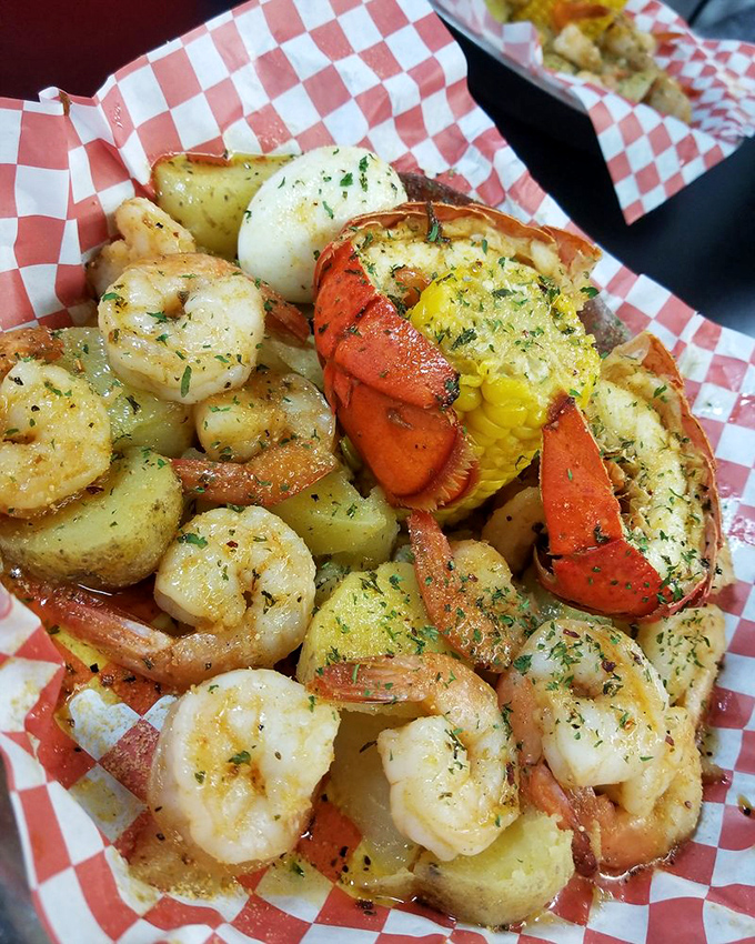 Ocean meets farmland in this harmonious arrangement. The shrimp and lobster tail are having such a good time, they invited corn and potatoes to join the butter-soaked celebration. 