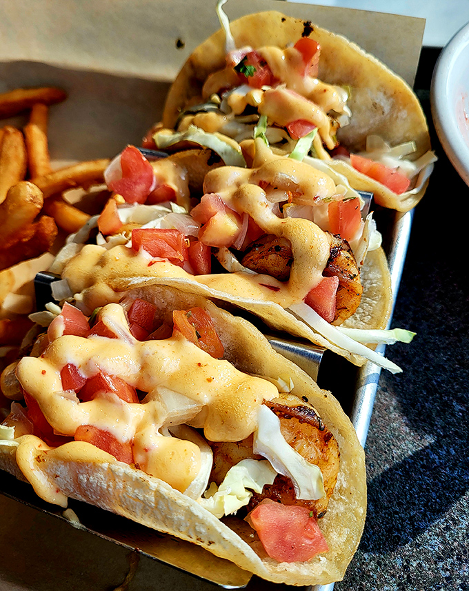 These shrimp tacos aren't just a meal; they're a vacation for your taste buds. The sauce drizzle is pure genius.