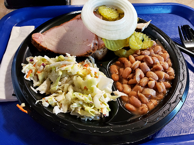 A perfect barbecue trinity &ndash; tender ham, creamy coleslaw, and pinto beans that have been simmering since dawn. Simple pleasures, profound satisfaction.