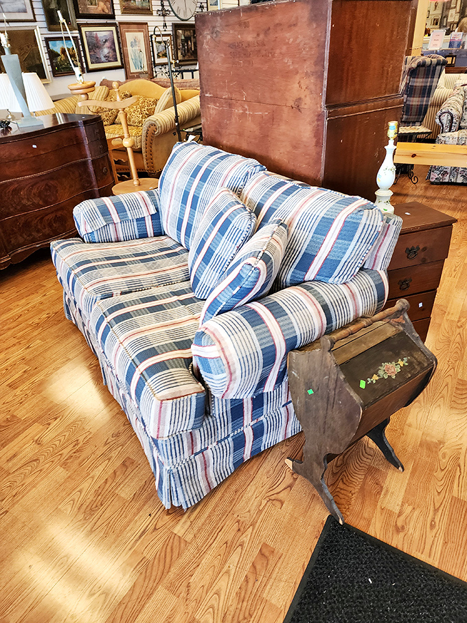 That striped sofa has seen things. Now it's just waiting for someone to give it a second chance and perhaps a strategic throw pillow.