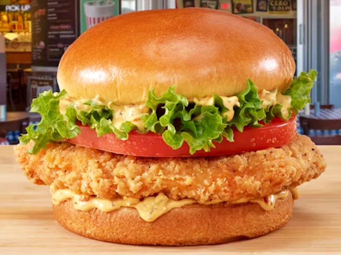 The breaded chicken sandwich stands tall and proud, like a crispy monument to the art of proper frying. That golden crust deserves a medal.