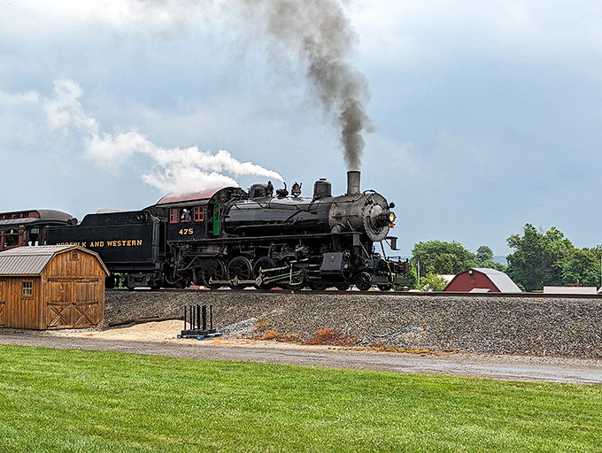 A steam locomotive chugs past the farm, blending agricultural and industrial heritage. Thomas the Tank Engine's more sophisticated grandfather, if you will.