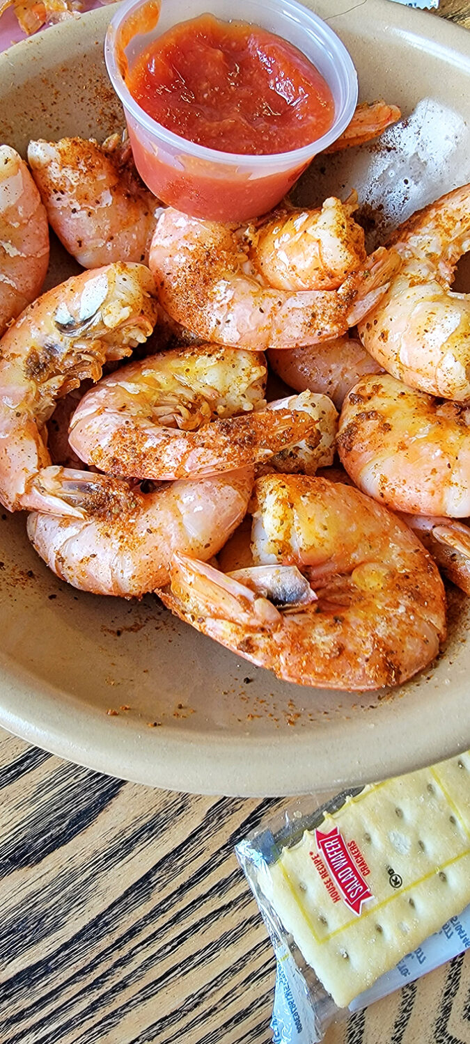 These steamed shrimp aren't just food; they're little pink crescents of oceanic perfection waiting for their lemon-butter bath.