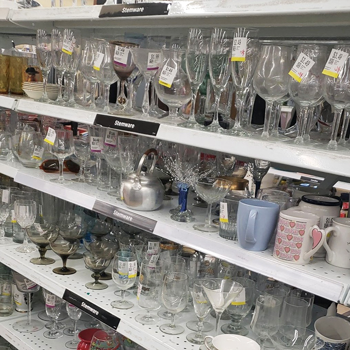 A crystal forest of stemware – from elegant champagne flutes to quirky cocktail glasses, each with stories of celebrations past.