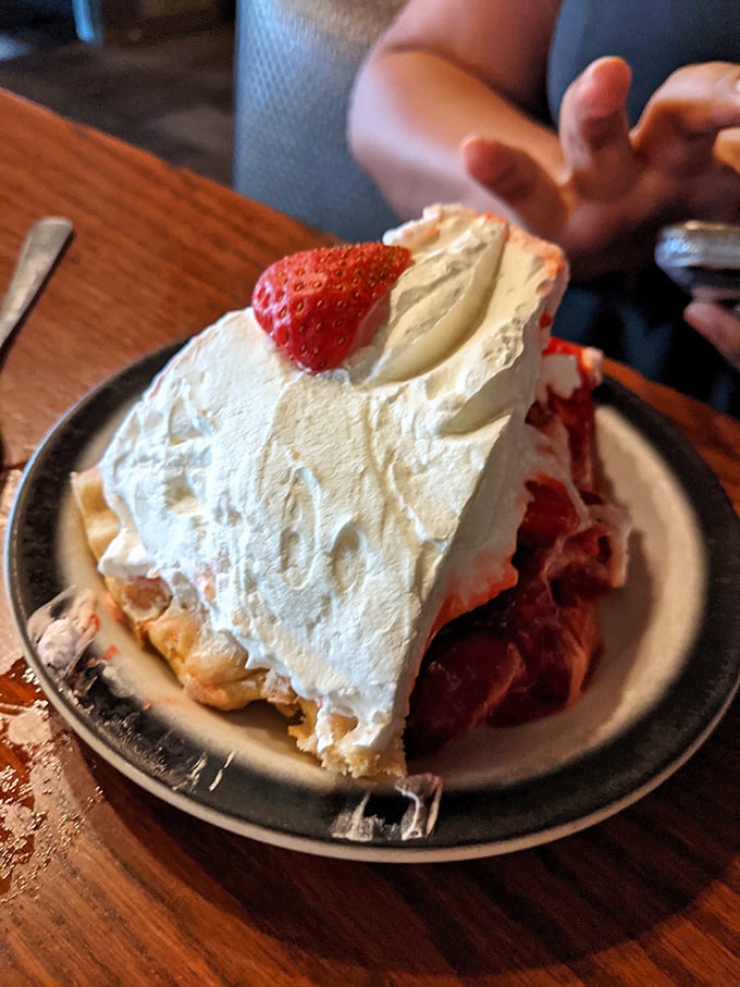 That strawberry pie isn't just dessert&mdash;it's a towering achievement of cream, crust, and fruit that demands to be photographed before it's devoured.