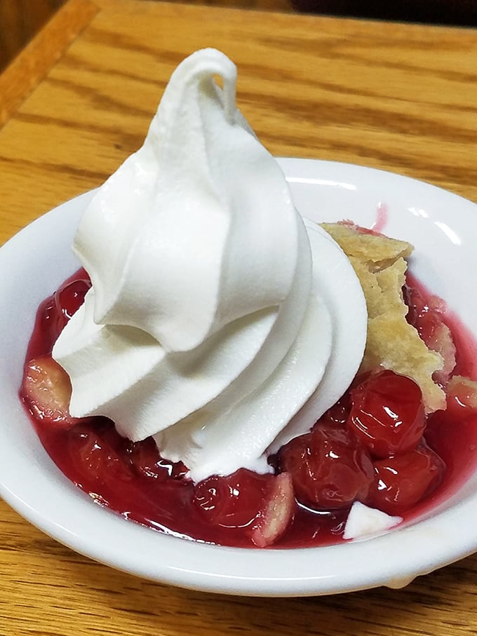 The legendary strawberry shortcake that launched a thousand return visits. That whipped cream mountain atop berry paradise isn't just dessert—it's therapy.