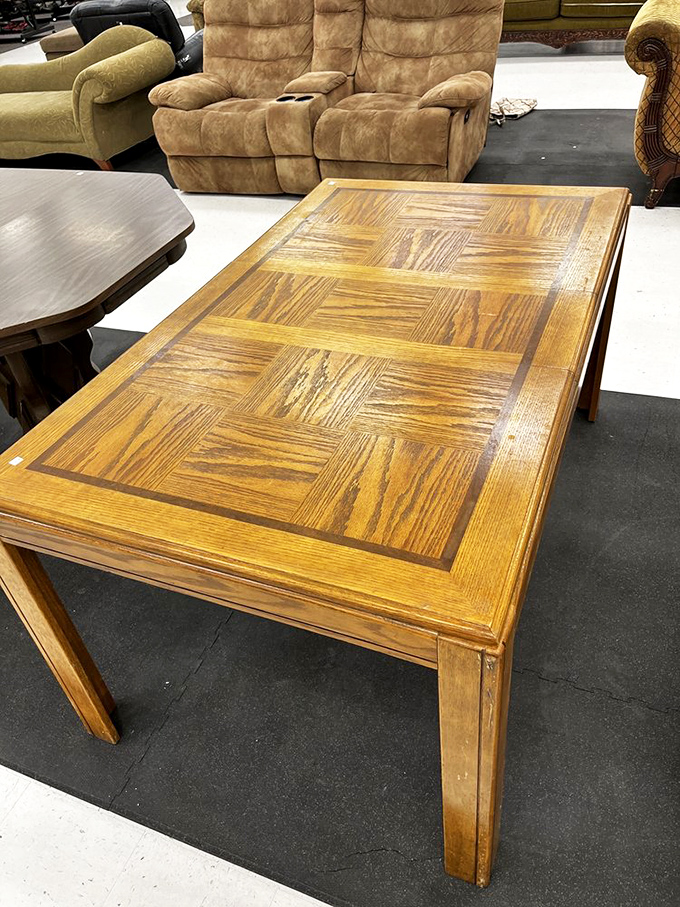 Solid oak craftsmanship that puts today's particle board to shame. This table has probably hosted more family dinners than Thanksgiving itself.