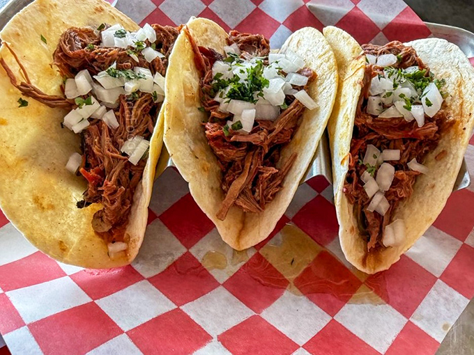 Barbecue tacos: where smoke meets street food. The diced onions and fresh cilantro cut through the rich meat like a well-timed joke.