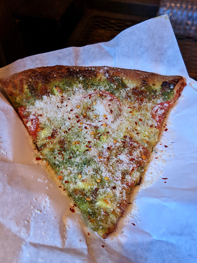 Pesto pizza that's wearing its Sunday best. That dusting of parmesan is like freshly fallen snow on a verdant Italian hillside.