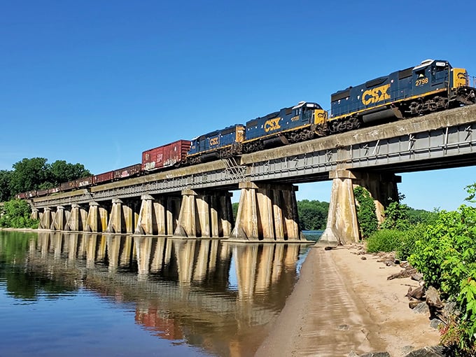 The CSX train rumbles across history. Where commerce meets nature in a daily ballet that's been performed for generations.