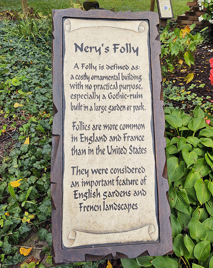 "Nery's Folly" sign explains these ornamental structures with European roots&mdash;architectural whimsy that's rare in American gardens but perfect here.