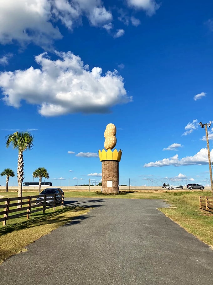 Palm trees and peanuts&mdash;a uniquely Georgian pairing. The pathway invites visitors to approach the monument from every angle for that perfect vacation shot.