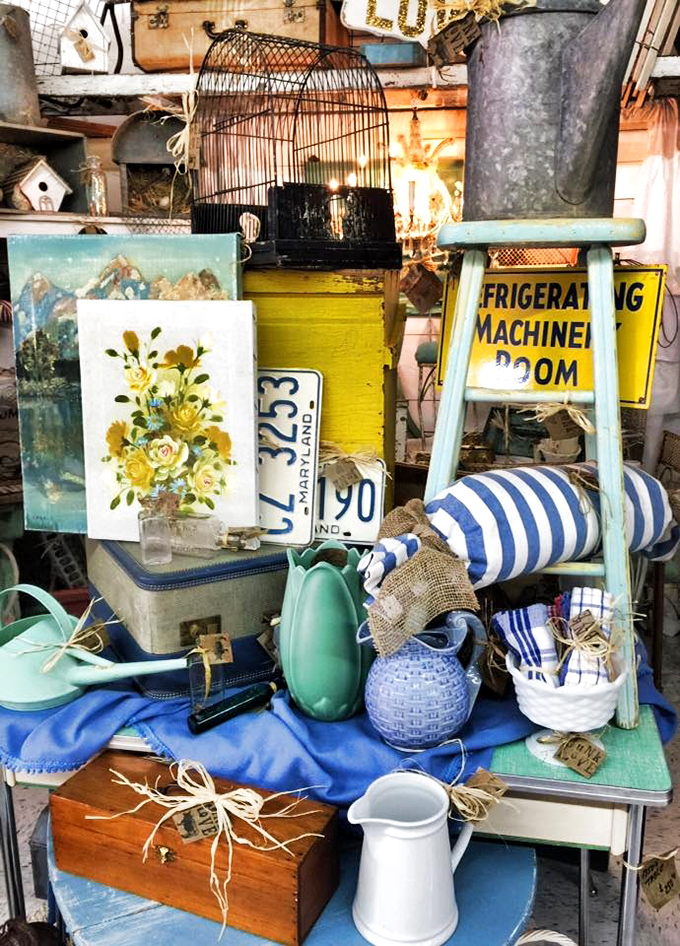 A treasure hunter's paradise where license plates, birdcages, and floral paintings create a beautiful jumble of Americana that Instagram filters can't replicate.