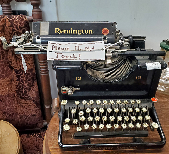 "Please Do Not Touch!" warns the Remington typewriter, as if protecting the ghost novels and love letters trapped in its keys.