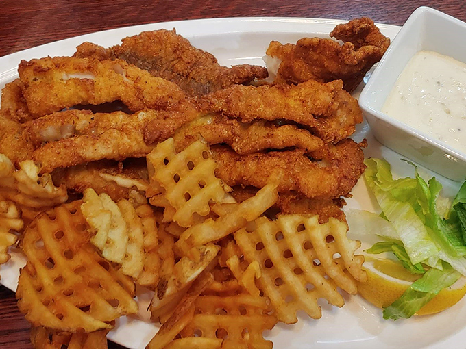 The golden architecture of these waffle fries deserves its own blueprint. Perfect lattice structure, ideal crispiness &ndash; this is potato engineering at its finest.