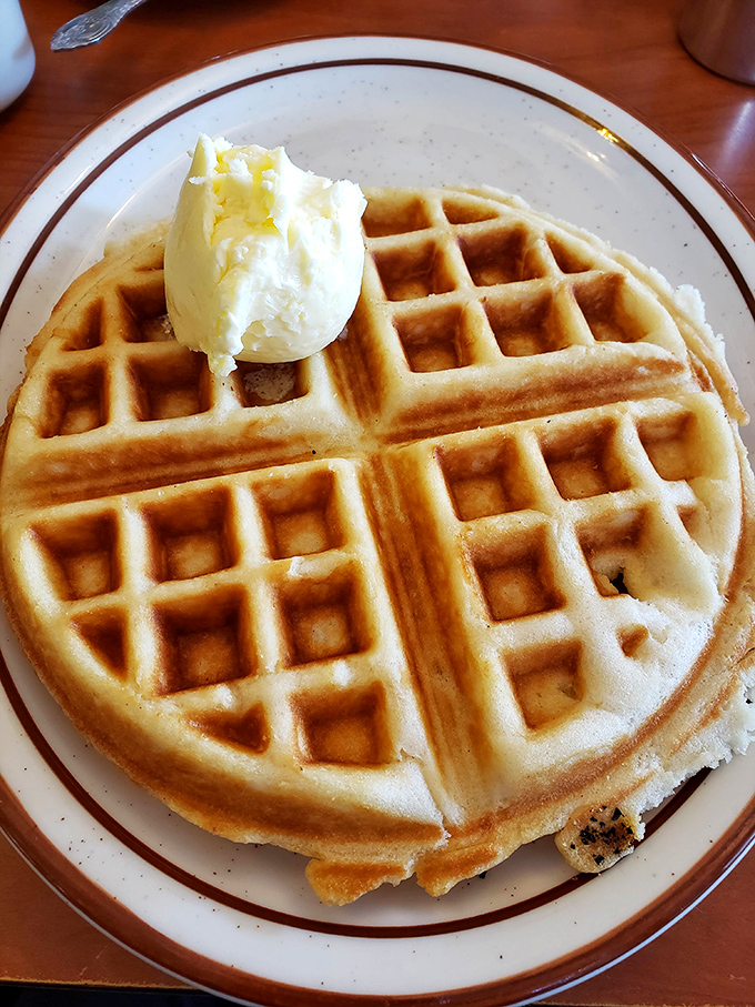 The perfect waffle doesn't exi&mdash; wait, there it is, with its precise grid of syrup reservoirs and a butter crown fit for breakfast royalty.