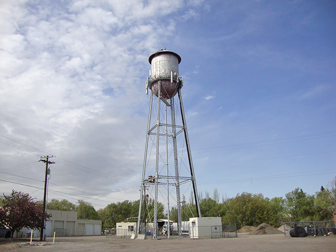 The town water tower rises above Shoshone like an industrial lighthouse, a beacon of small-town infrastructure that's become an unexpected icon of rural America.