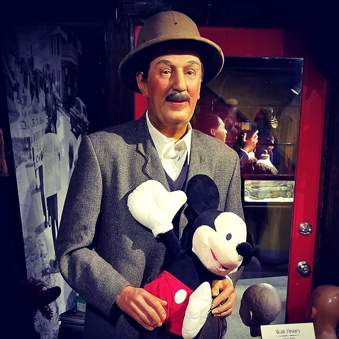 Walt Disney holds Mickey Mouse with that gleam in his eye that says, "One day, this mouse will help me buy half of Florida."