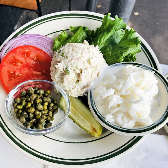A plate that speaks volumes without saying a word: whitefish salad, capers, tomato, and onion—the Upper West Side's answer to a perfect lunch.