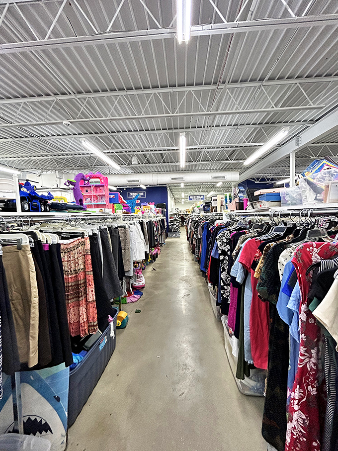 The thrifter's paradise: meticulously organized clothing aisles where designer labels hide among everyday brands, waiting for the eagle-eyed shopper.