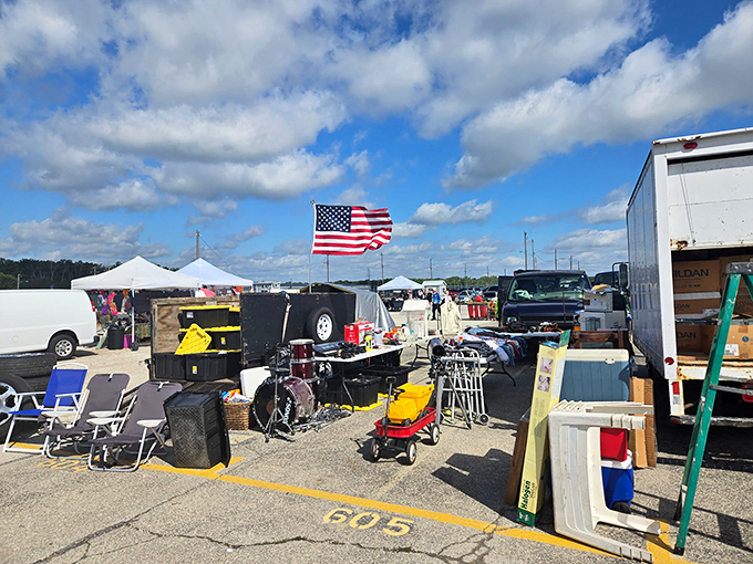 That American flag flies proudly over a marketplace where capitalism meets community in perfect harmony.